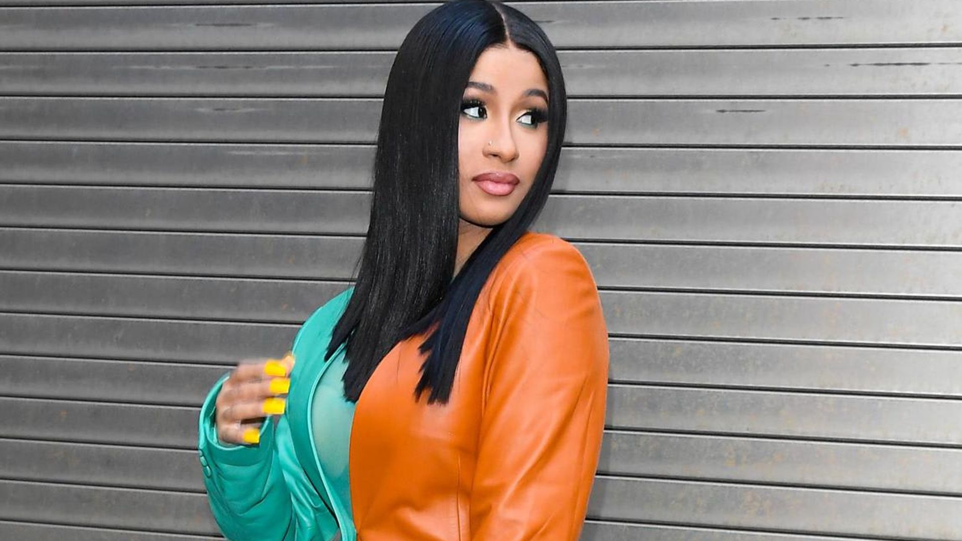 Cardi B rocks a color-block suit for Vogue Fashion of Forces panel