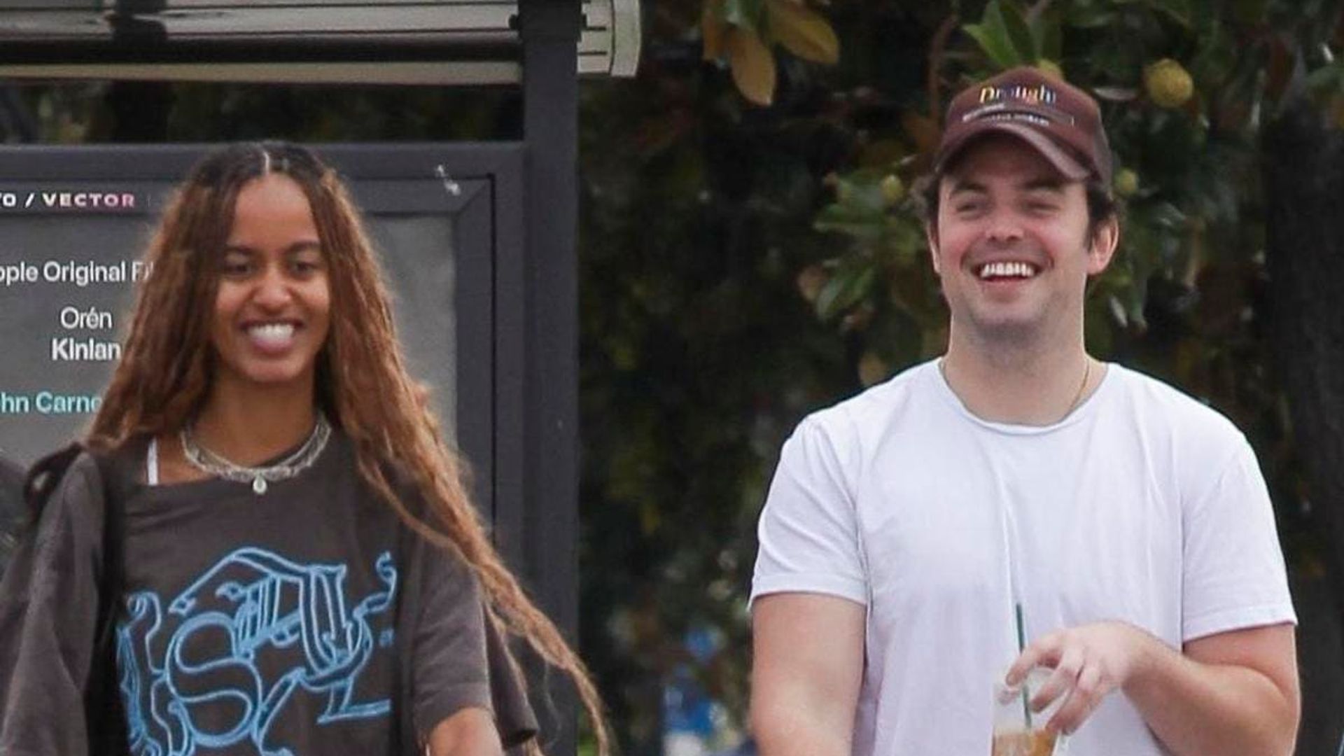 Malia Obama giggles and smiles with a friend in Los Angeles