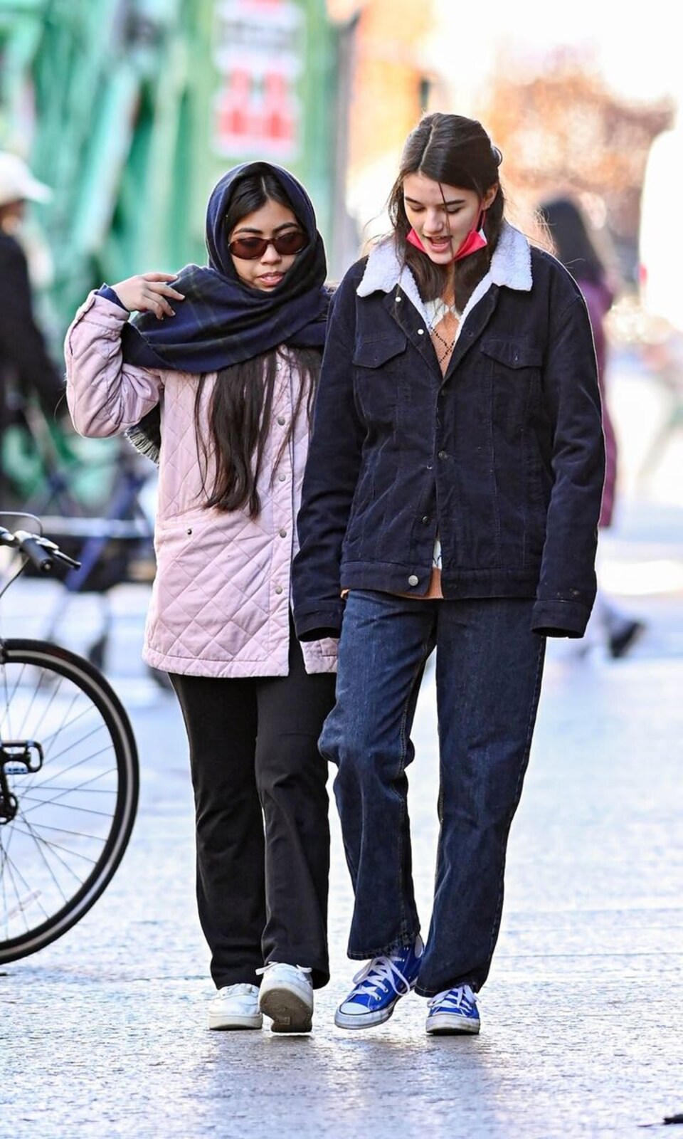 Suri Cruise spends the day with a friend in chilly NYC