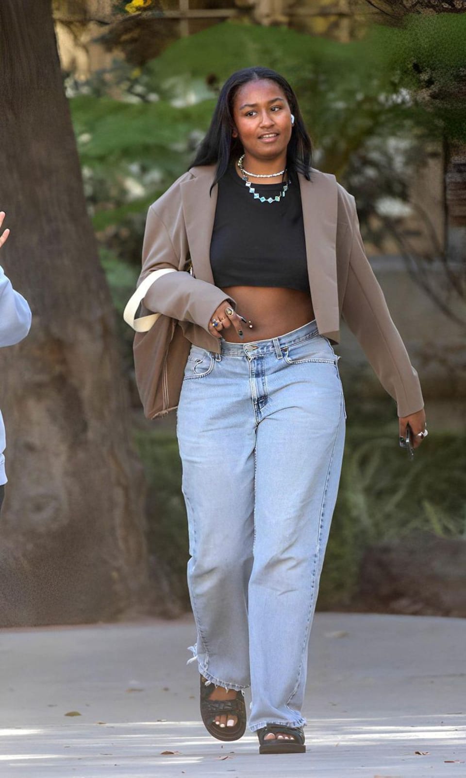 Sasha Obama shows her belly button piercing in crop top look