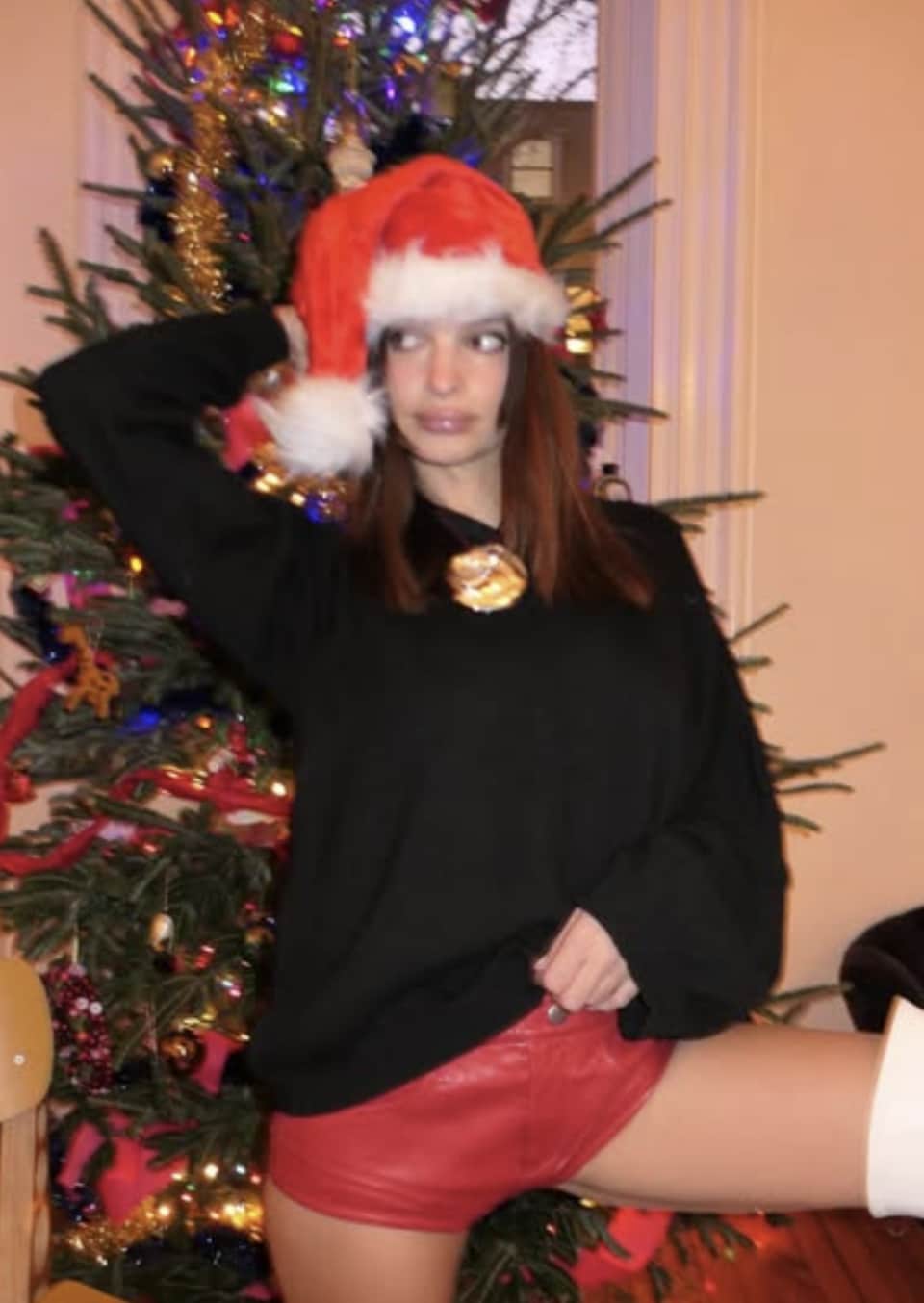 Emily Ratajkowski celebrates Christmas dressed up as a sexy Santa