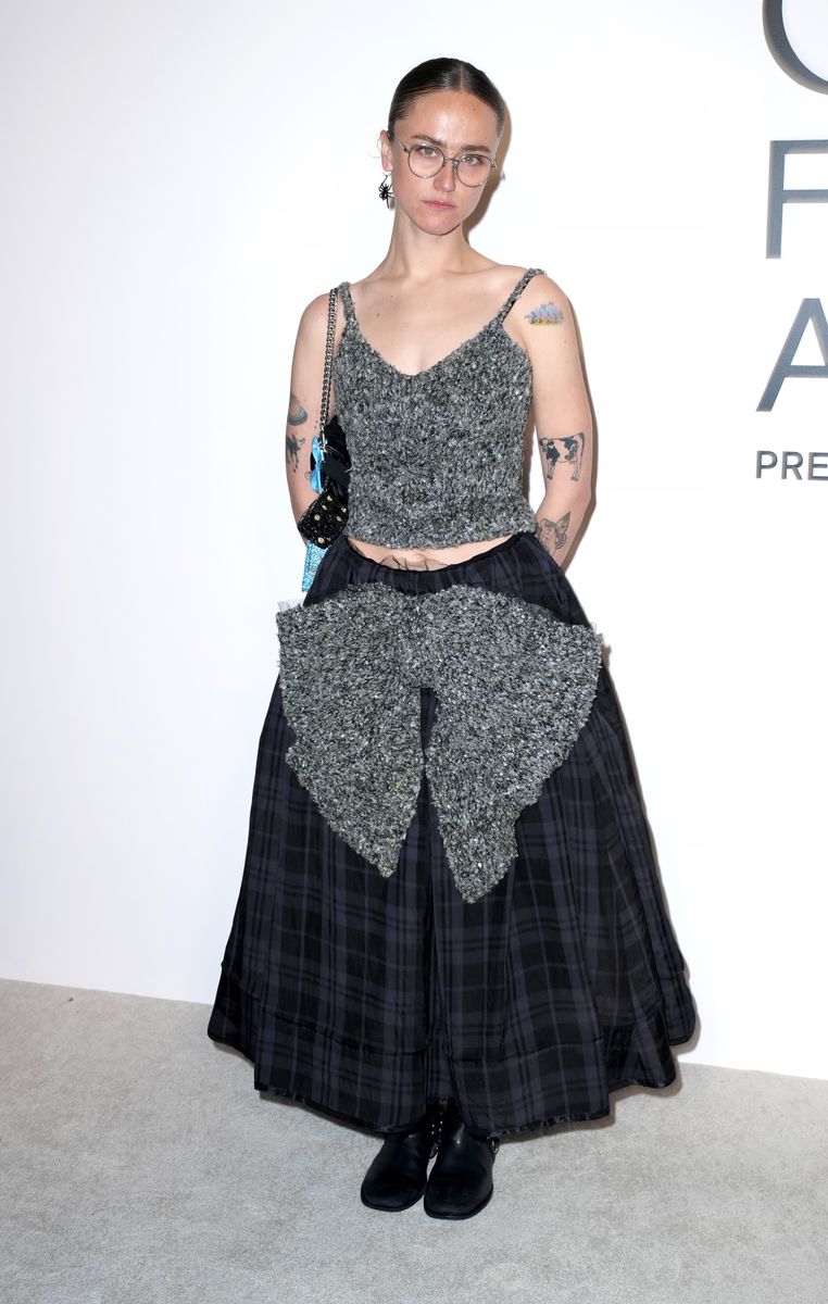 Ella Emhoff shows off her tattoo collection in fuzzy top and plaid ...