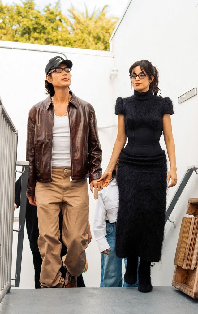 Camila Cabello is all smiles holding hands with Patrick Ta during Art ...