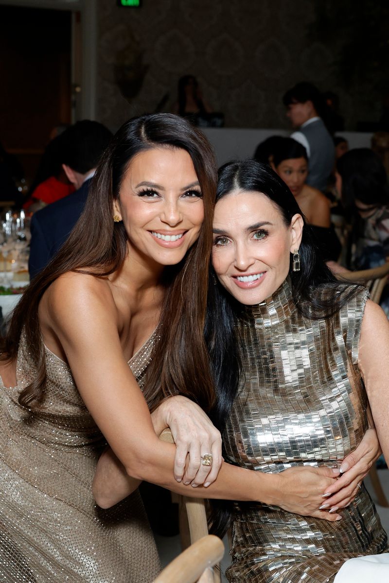 Eva Longoria poses with friends in a gorgeous golden gown