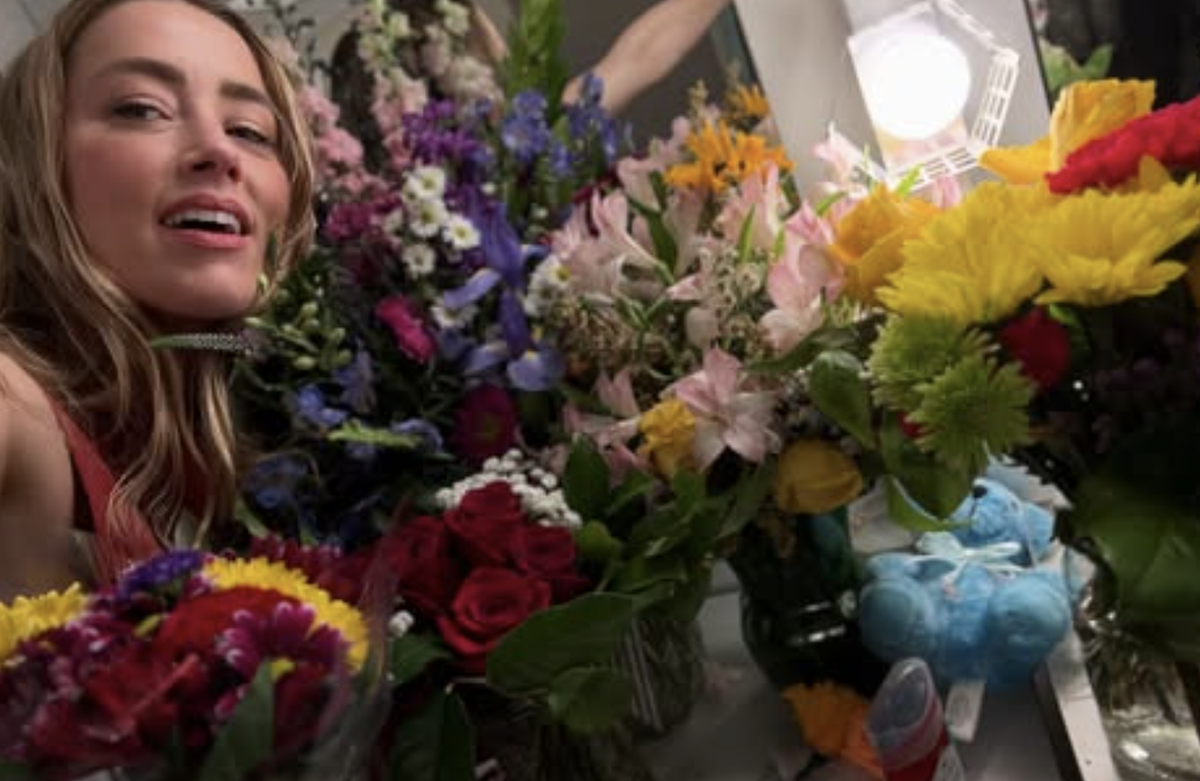 Amber Heard laughs and embraces life in Madrid after US trip