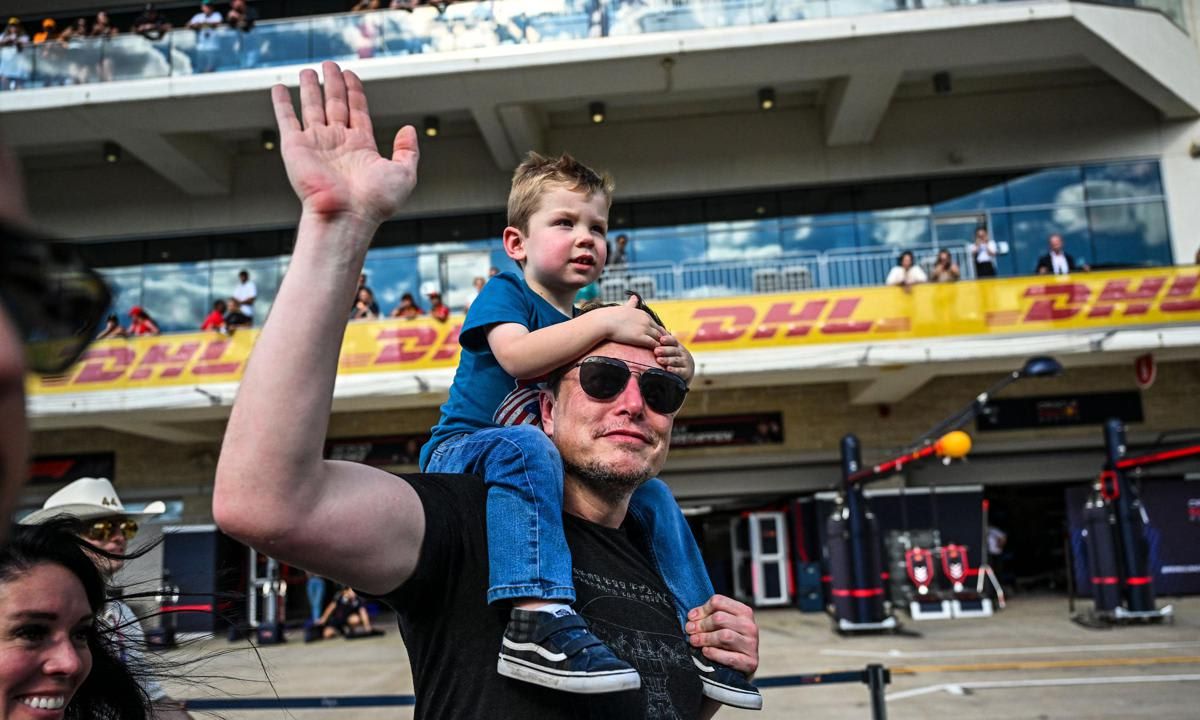 Elon Musk and his son attend the Formula 1 U.S. Grand Prix