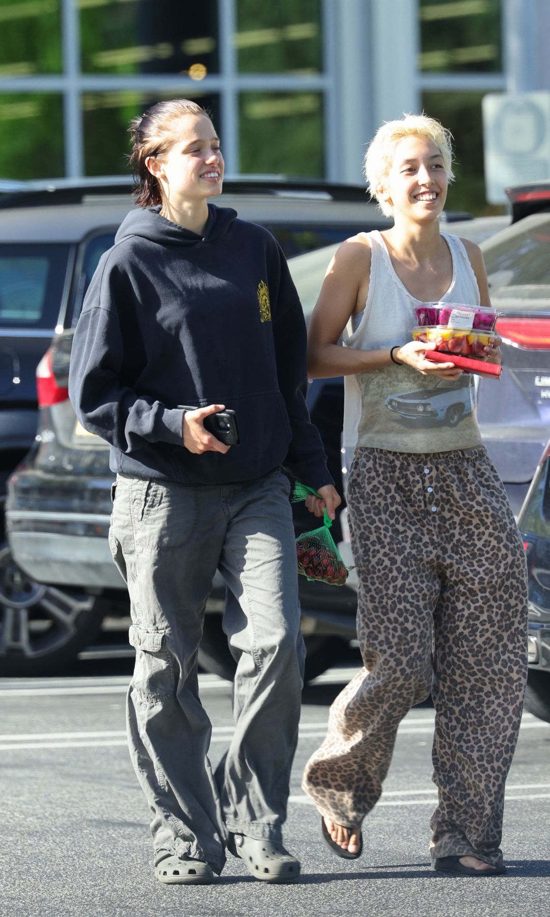 Shiloh Jolie debuts edgy brunette look with high bun and lip ring after ...