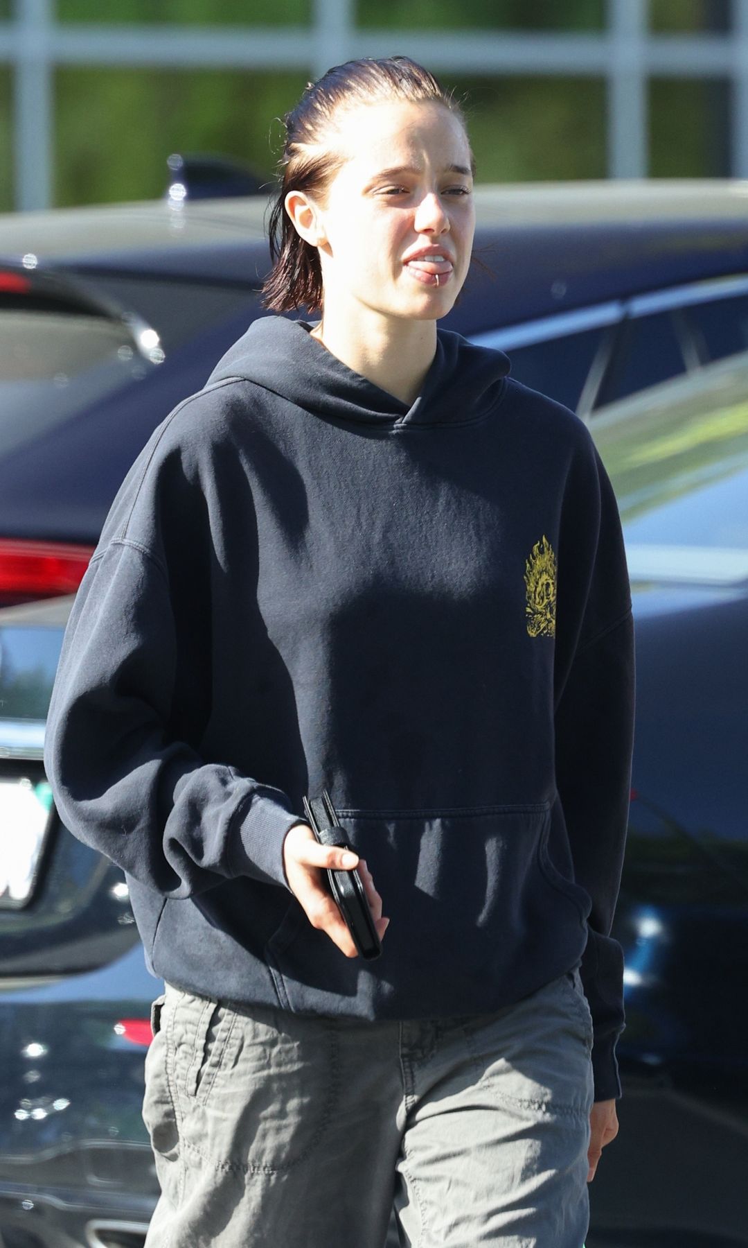 Shiloh Jolie debuts edgy brunette look with high bun and lip ring after ...