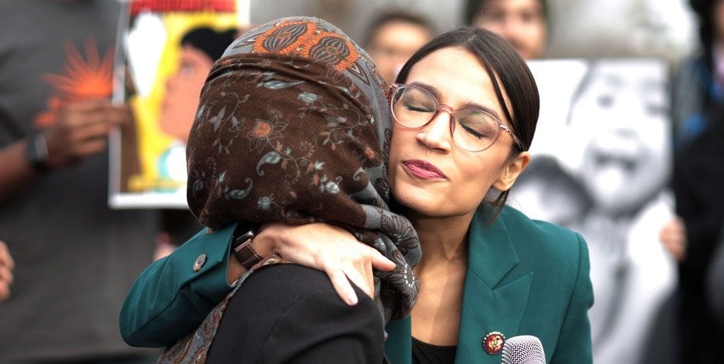 Alexandria Ocasio Cortez cries during immigration event